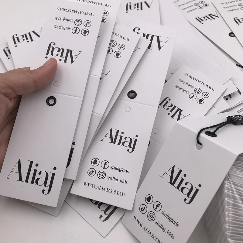 Custom 700g Art Paper Swing Tags With Matte Black Eyelet Clothing Hang ...
