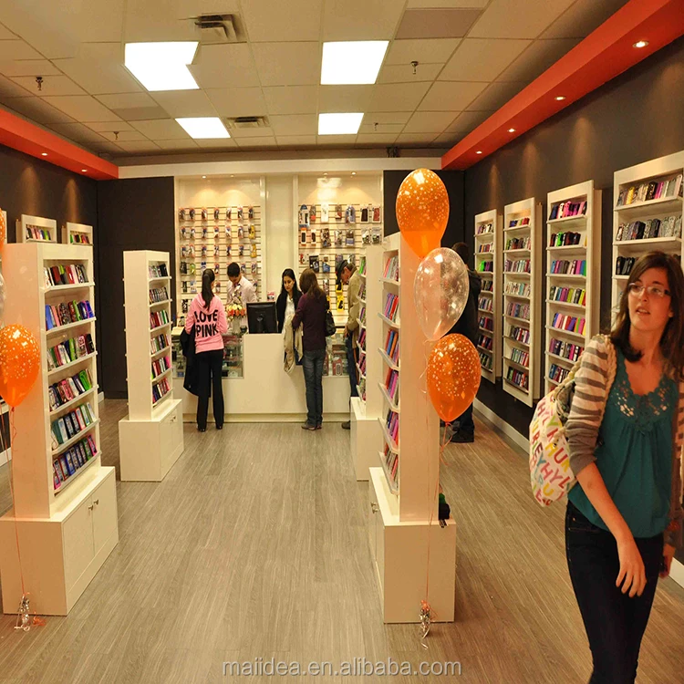 Simple white mobile phone shop counter interior design with slat wall